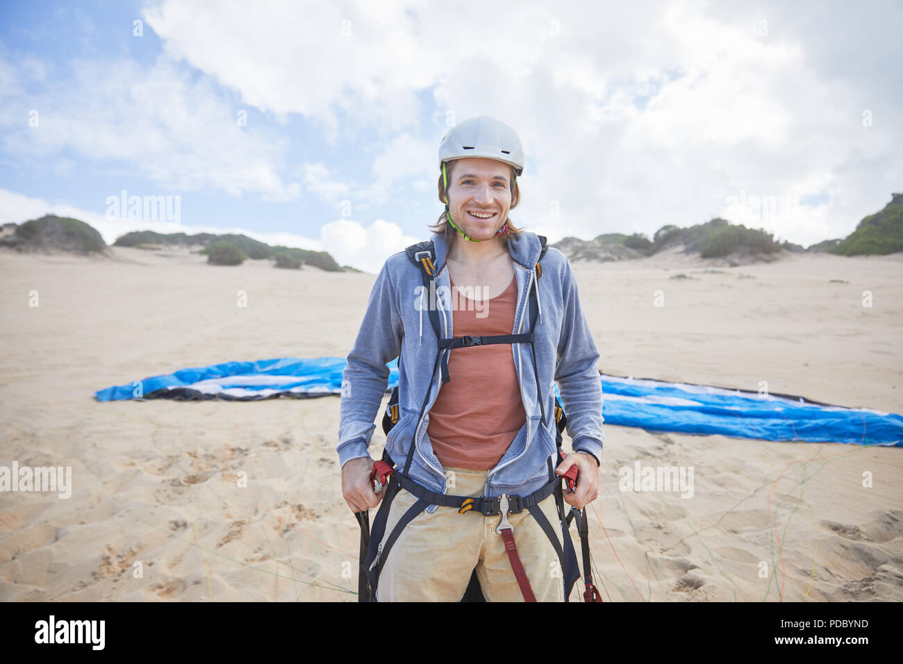 Portrait confident male paraglider on beach Stock Photo - Alamy