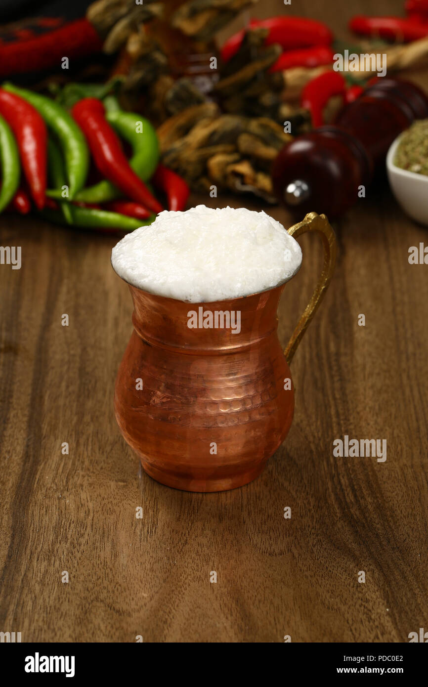 Turkish Drink Ayran or Buttermilk with foam in copper cup Stock Photo ...
