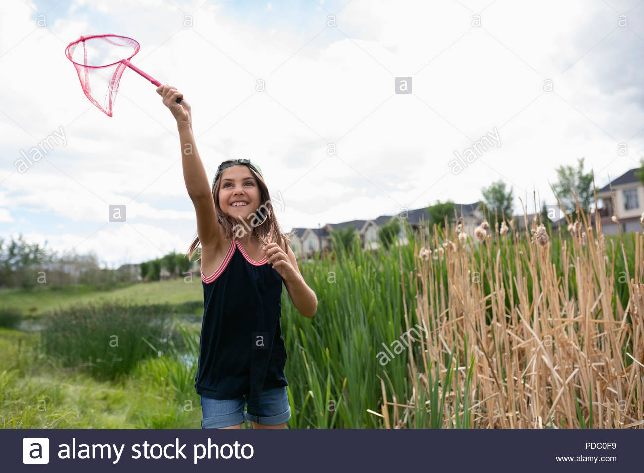 Girl catching butterfly hi-res stock photography and images - Alamy