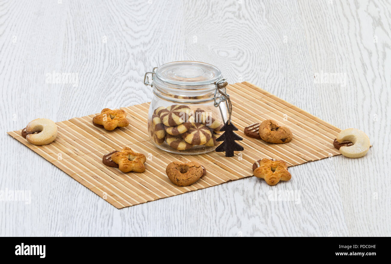 cookies and a jar of biscuits on the white kitchen table Stock Photo ...