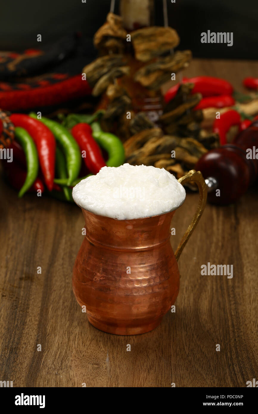 Turkish Drink Ayran or Buttermilk with foam in copper cup Stock Photo ...