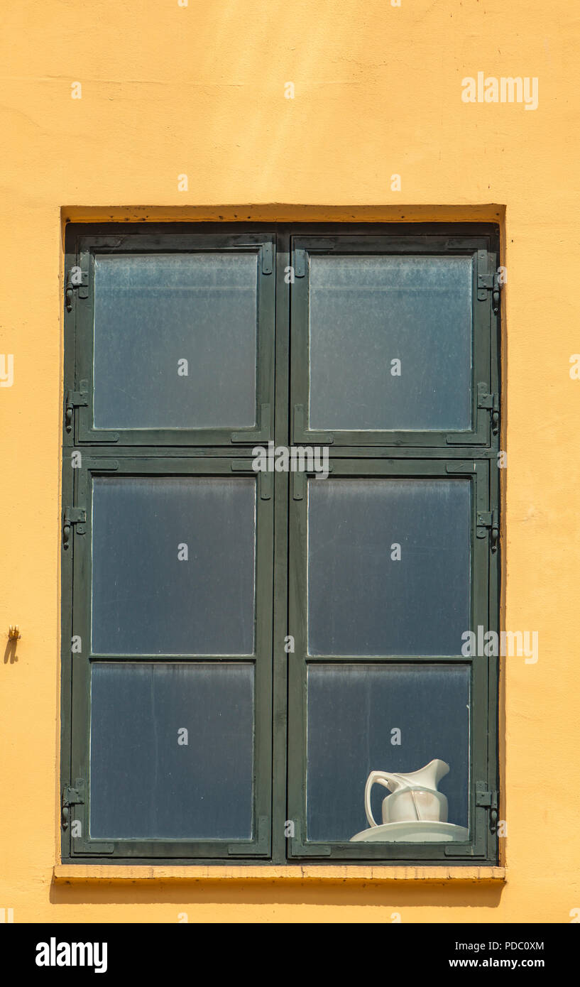 Window on the colorful facade from Nyhavn harbour, Copenhagen, Denmark ...