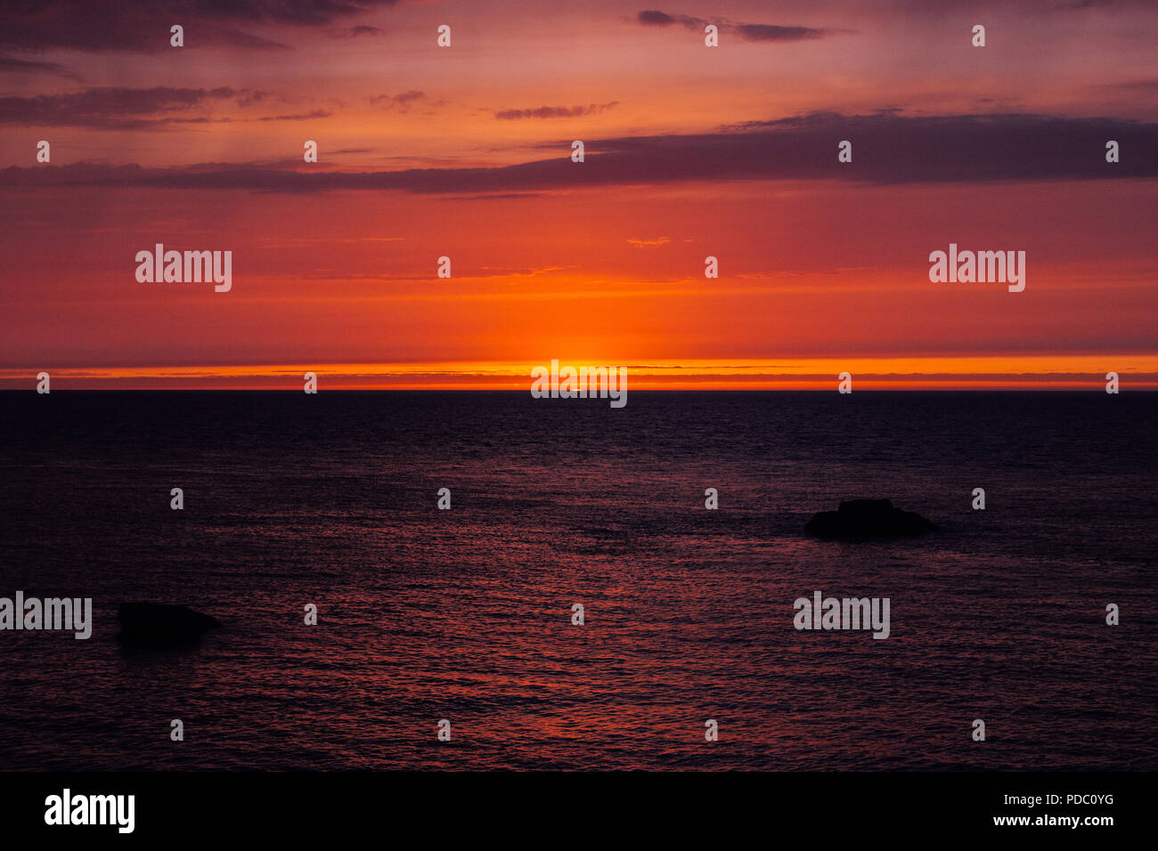 background with red sunset over the sea, Etretat, Normandy, France Stock Photo - Alamy