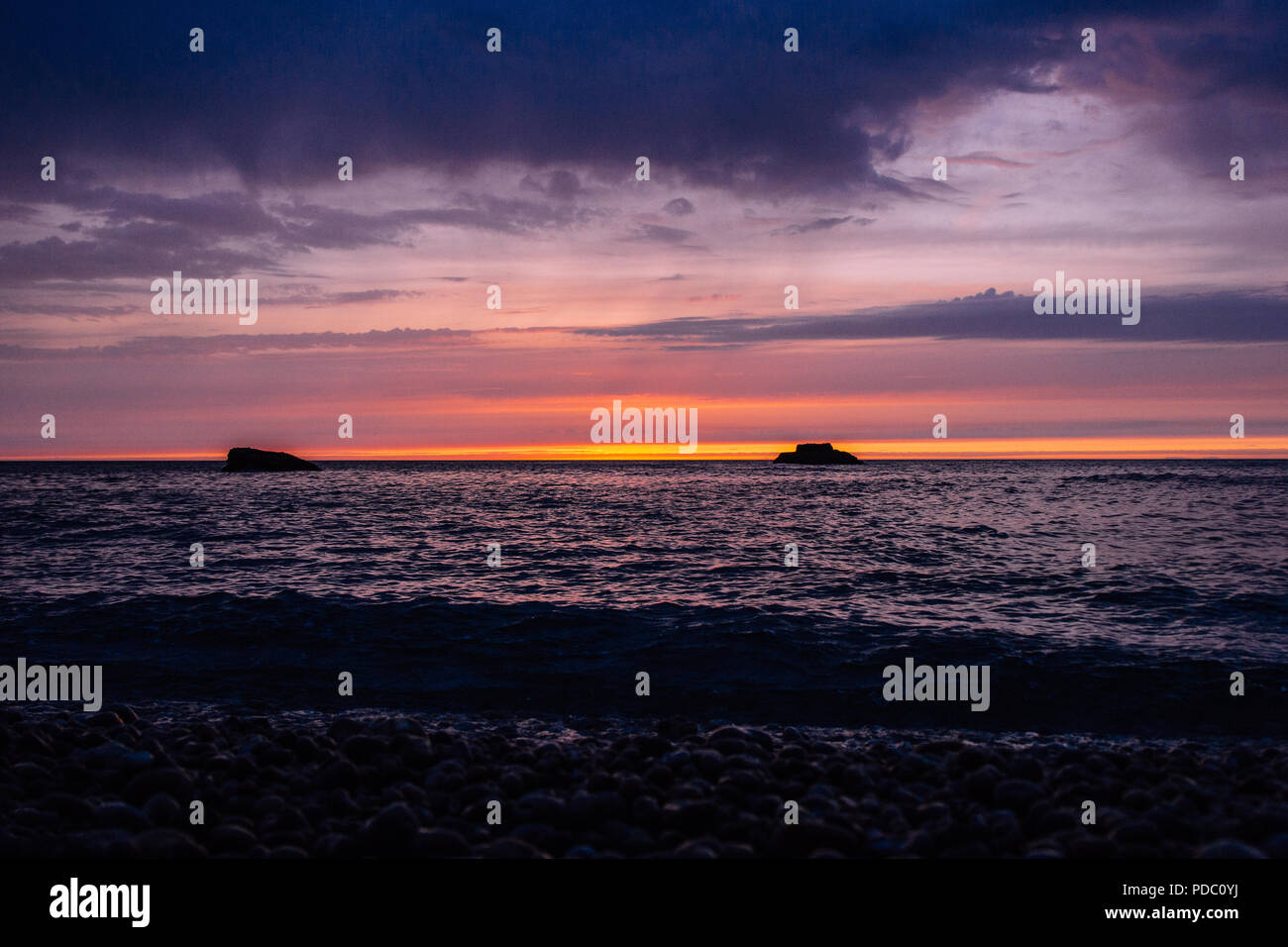 beautiful sunset over the calm sea, Etretat, Normandy, France Stock Photo - Alamy