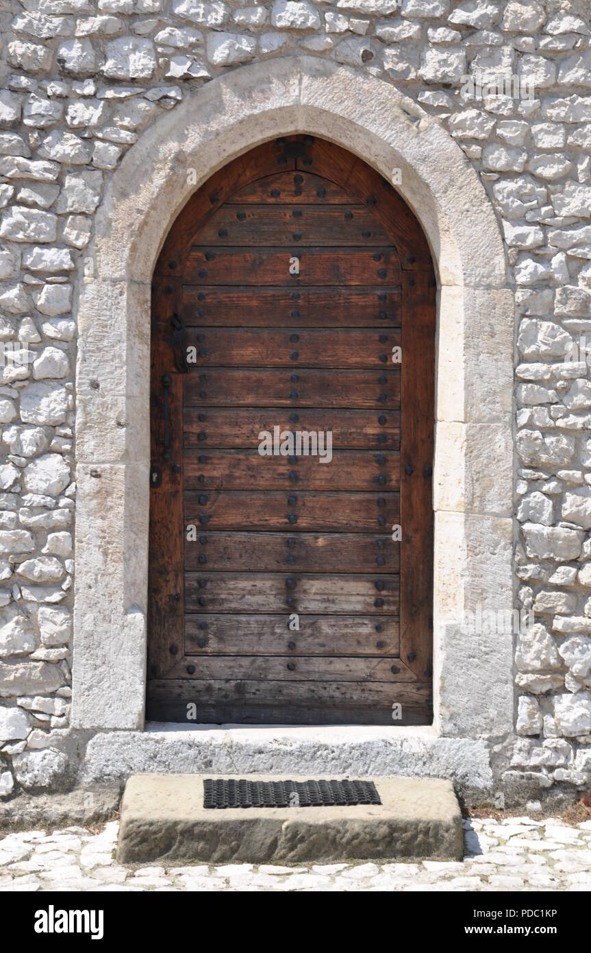 Ancient wooden door and stone wall Stock Photo - Alamy