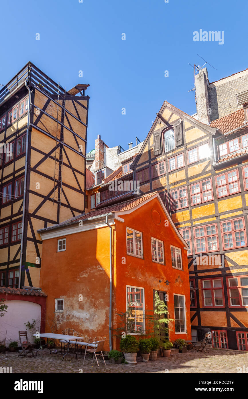low angle view of beautiful houses against blue sky and cozy empty yard ...