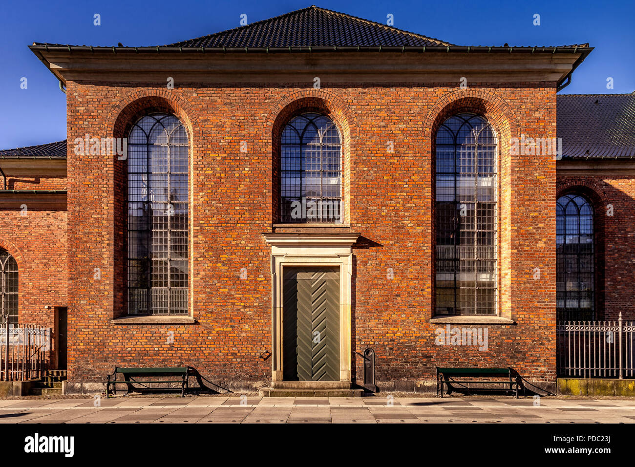beautiful brown building with large windows in empty street in ...
