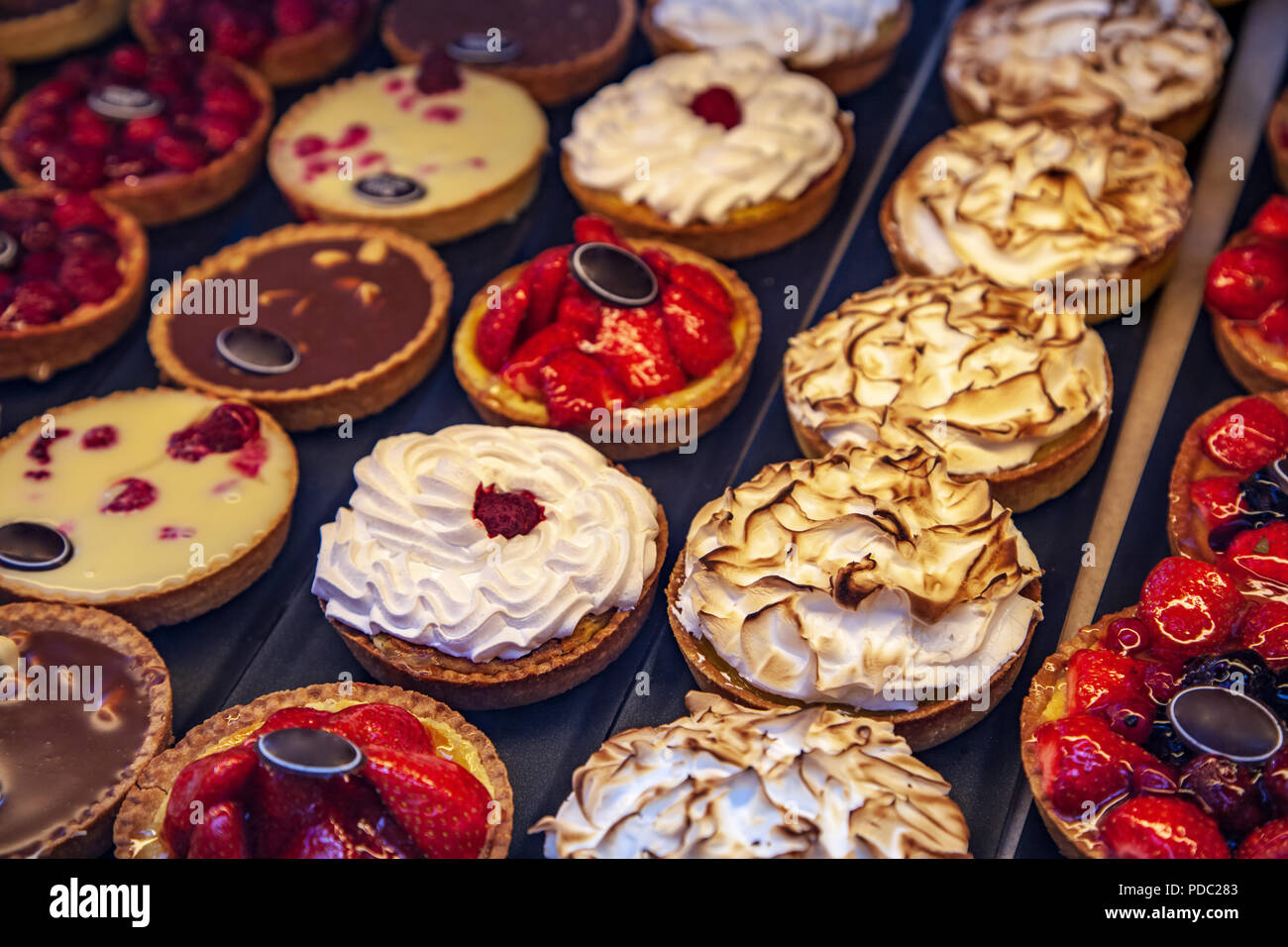 close up view of different cakes placed in rows Stock Photo - Alamy