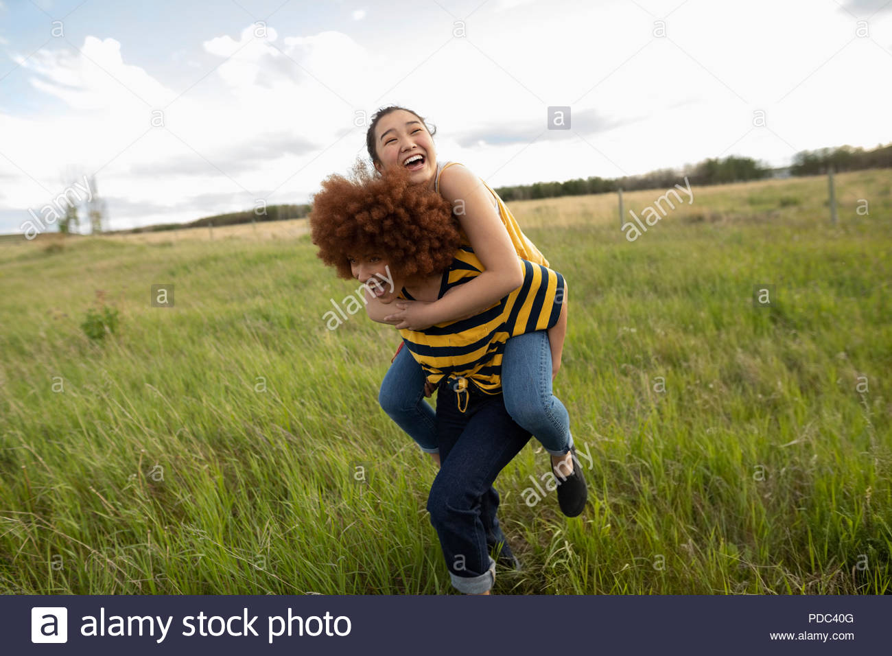 Two girls playing piggyback hi-res stock photography and images - Alamy