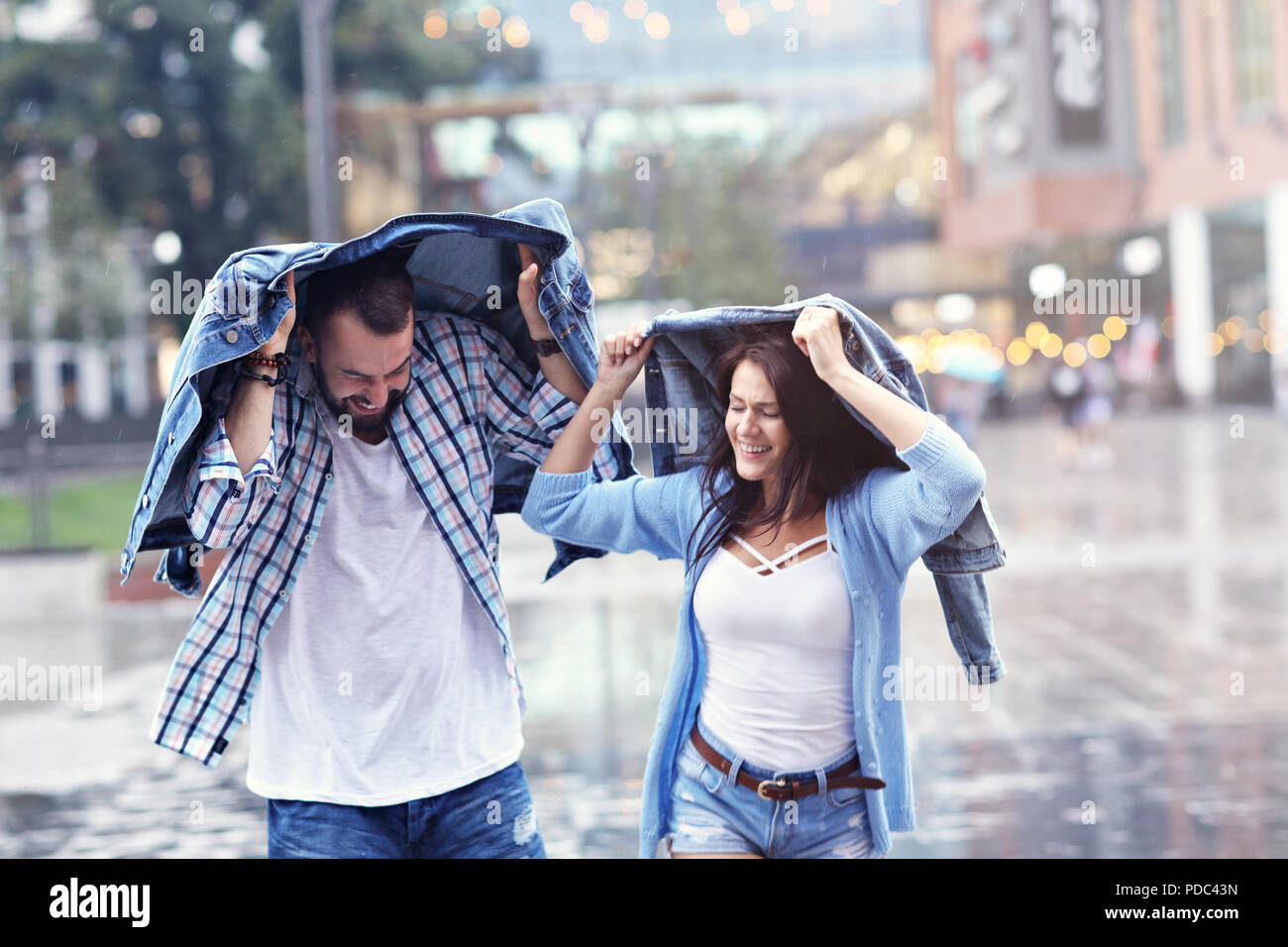 Running in the rain hi-res stock photography and images - Alamy