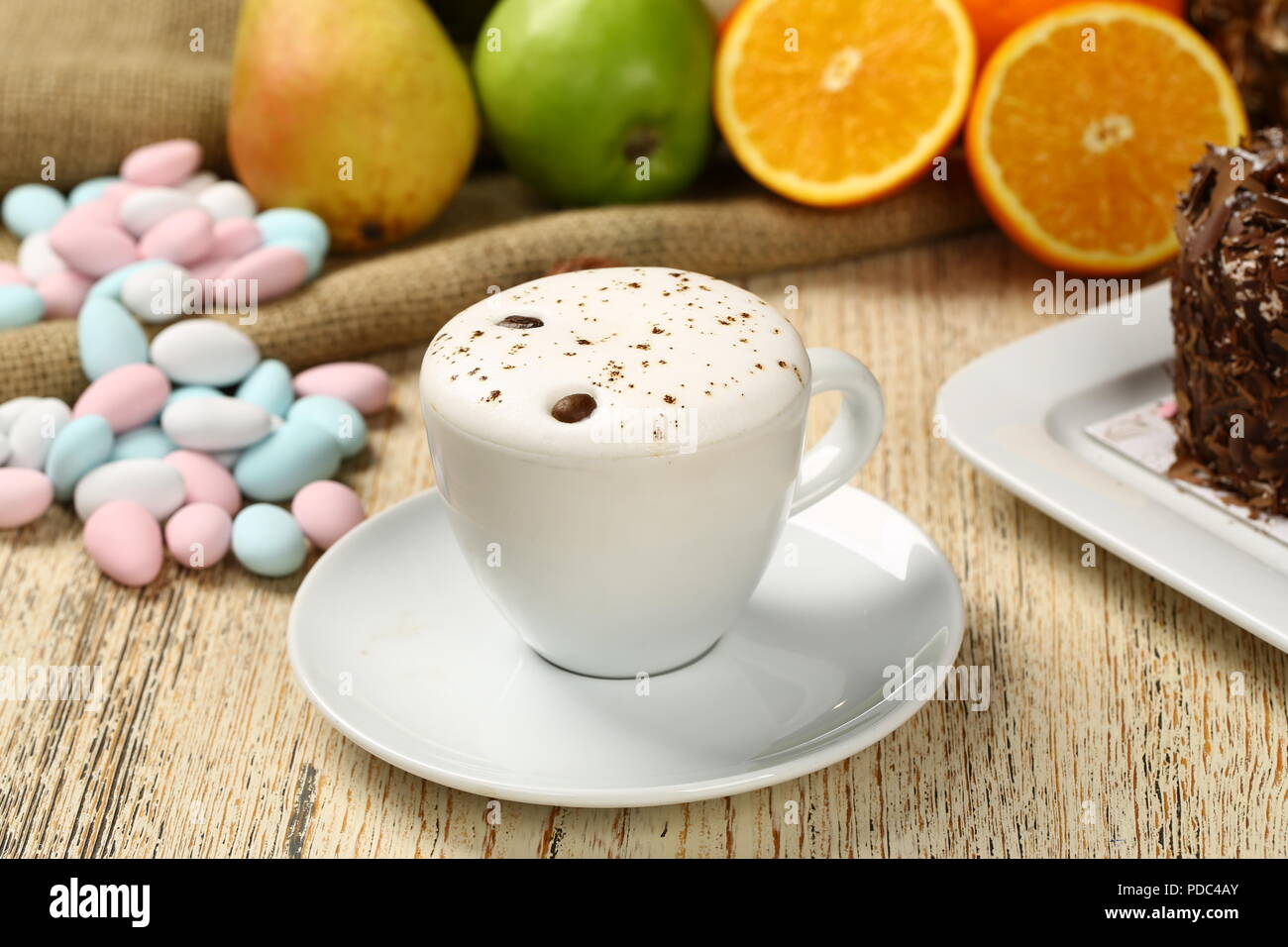 Cup of Cappucino with cookies and spoon served Stock Photo - Alamy