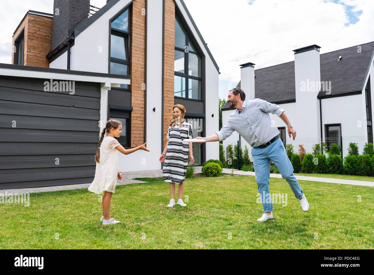 Nice happy man throwing the plate Stock Photo - Alamy