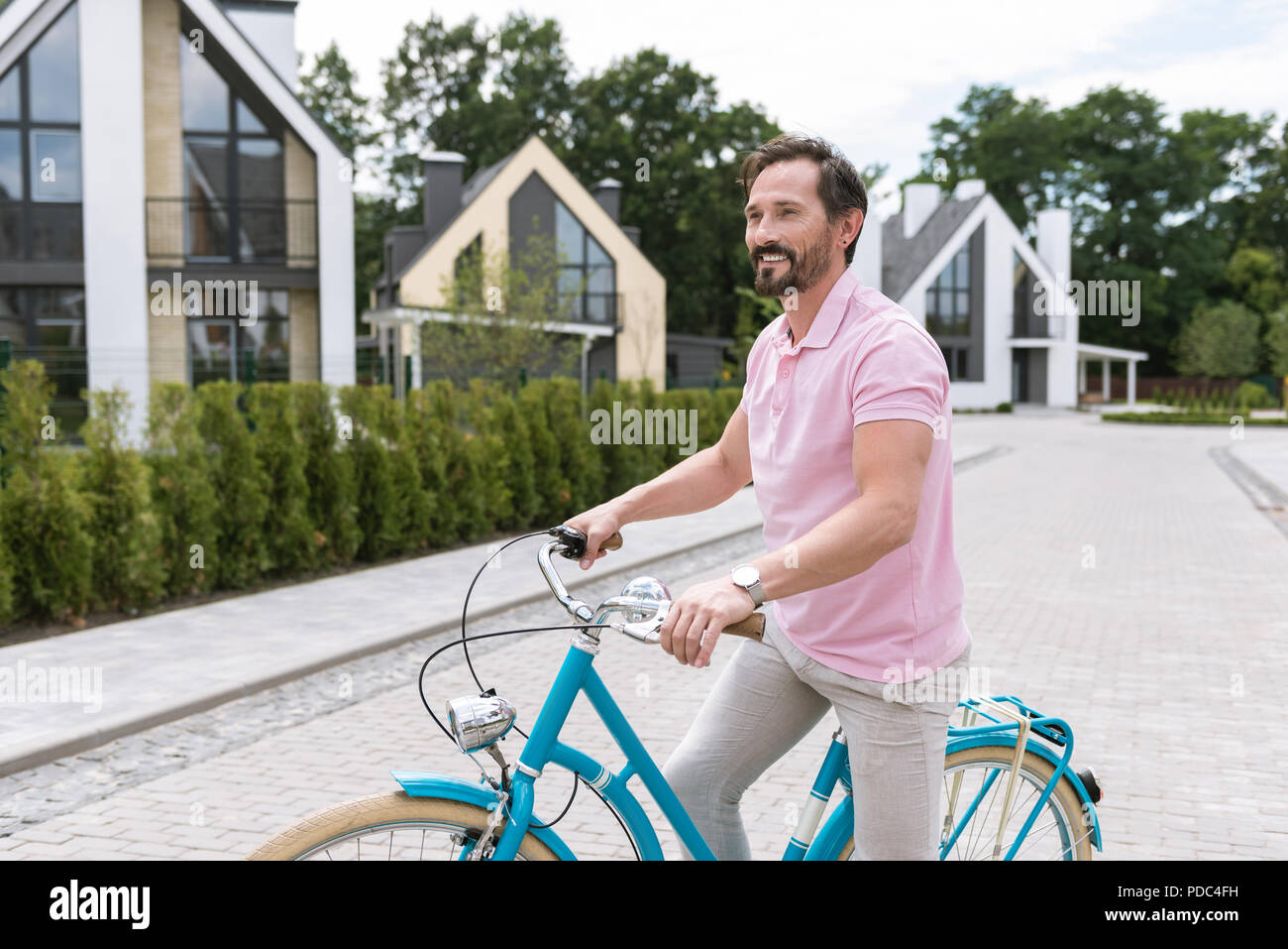 Nice handsome man riding a bike Stock Photo - Alamy