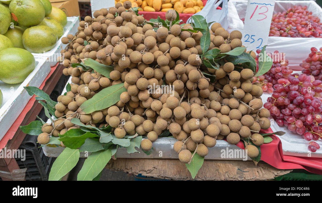 Big Bunch of Longan Tropical Fruits at Market Stock Photo - Alamy