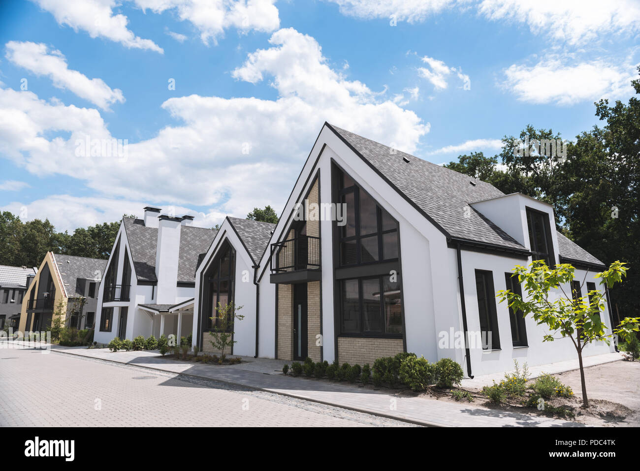 Beautiful new houses standing in a row Stock Photo - Alamy