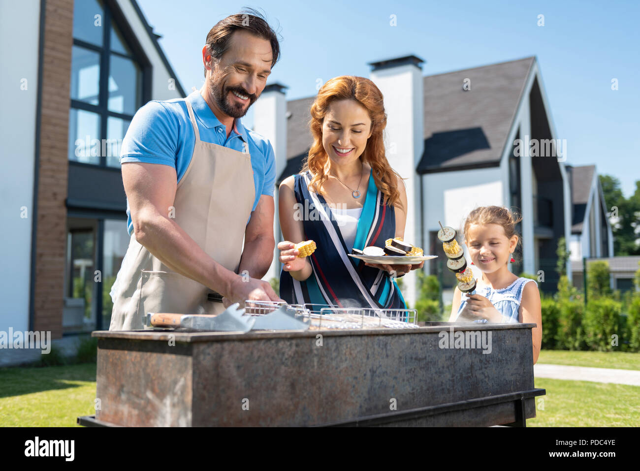 Joyful nice family enjoying their time together Stock Photo - Alamy