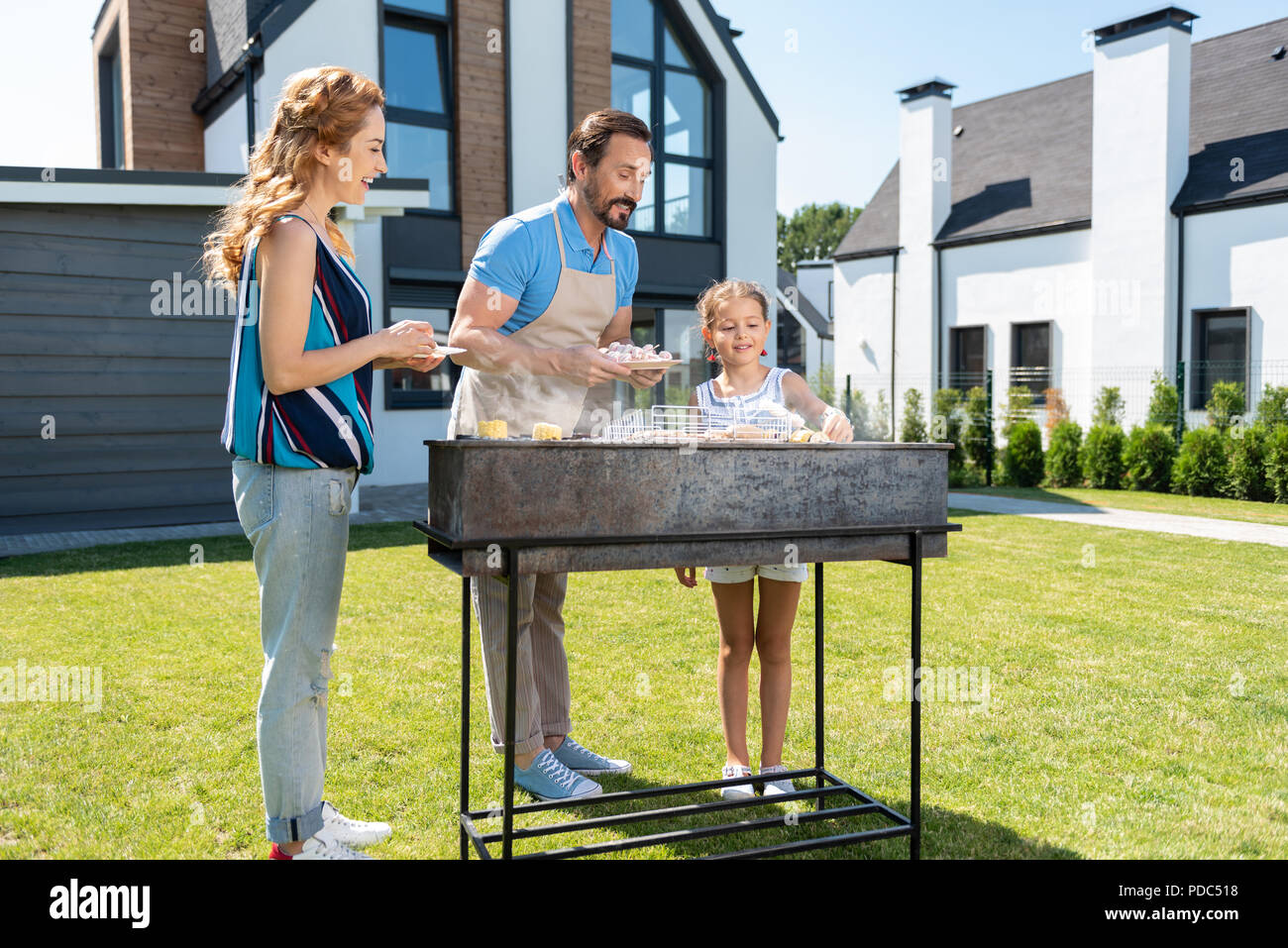 Father daughter preparing meat hi-res stock photography and images - Alamy