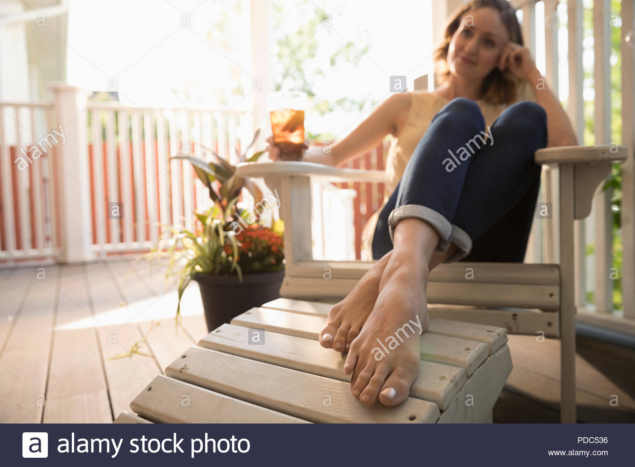 Adirondack chair on porch hi-res stock photography and images - Alamy