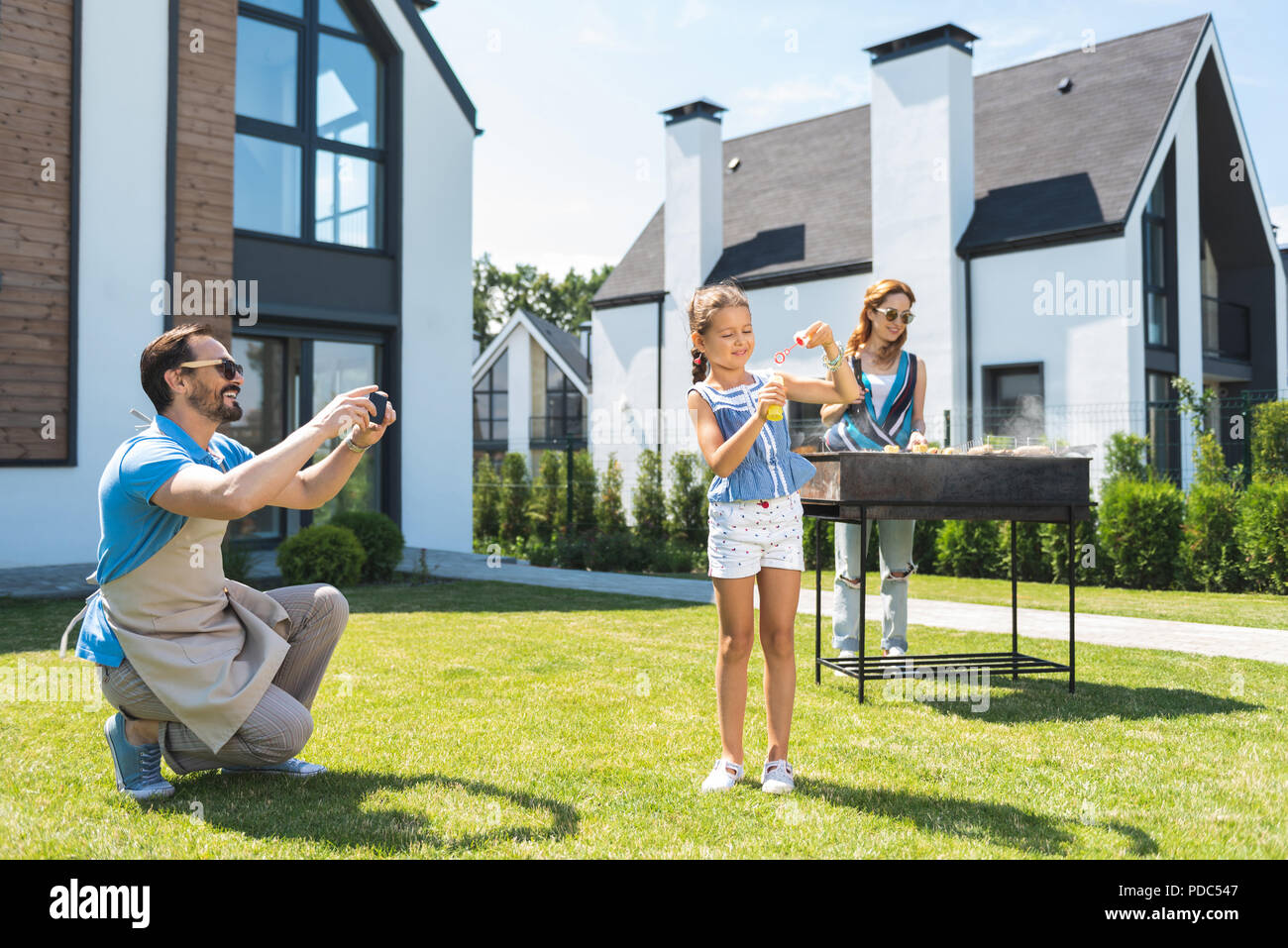 Positive happy father looking at her daughter Stock Photo - Alamy