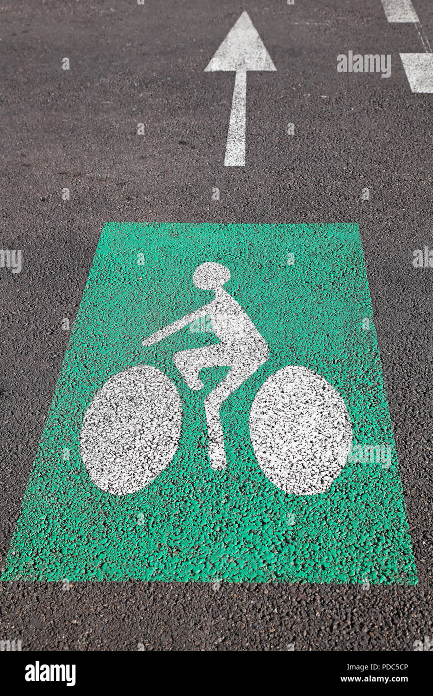 Arrow and bike lane sign at asphalt reserved for bicycles Stock Photo ...