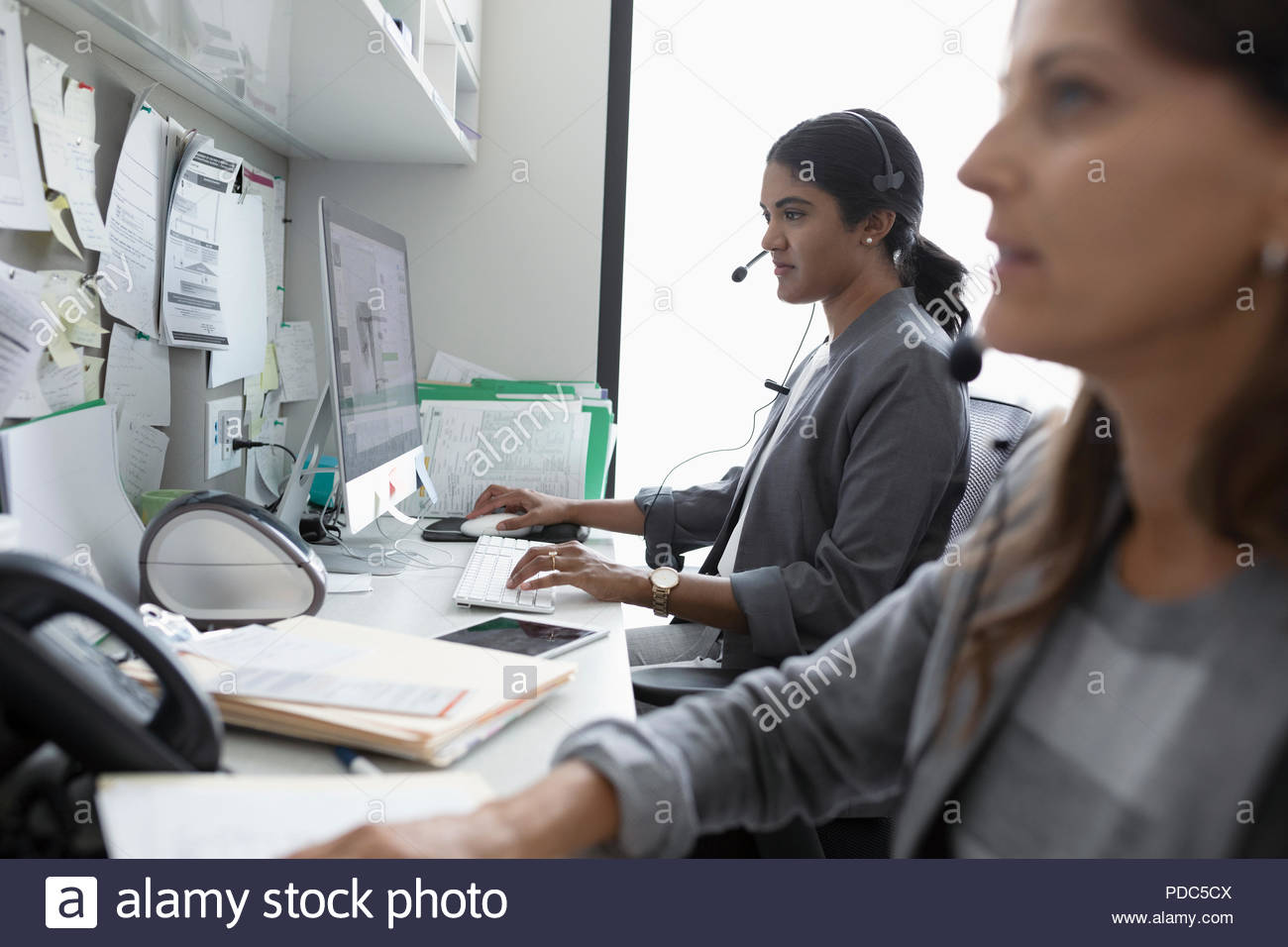 Two woman office working computer hi-res stock photography and images ...