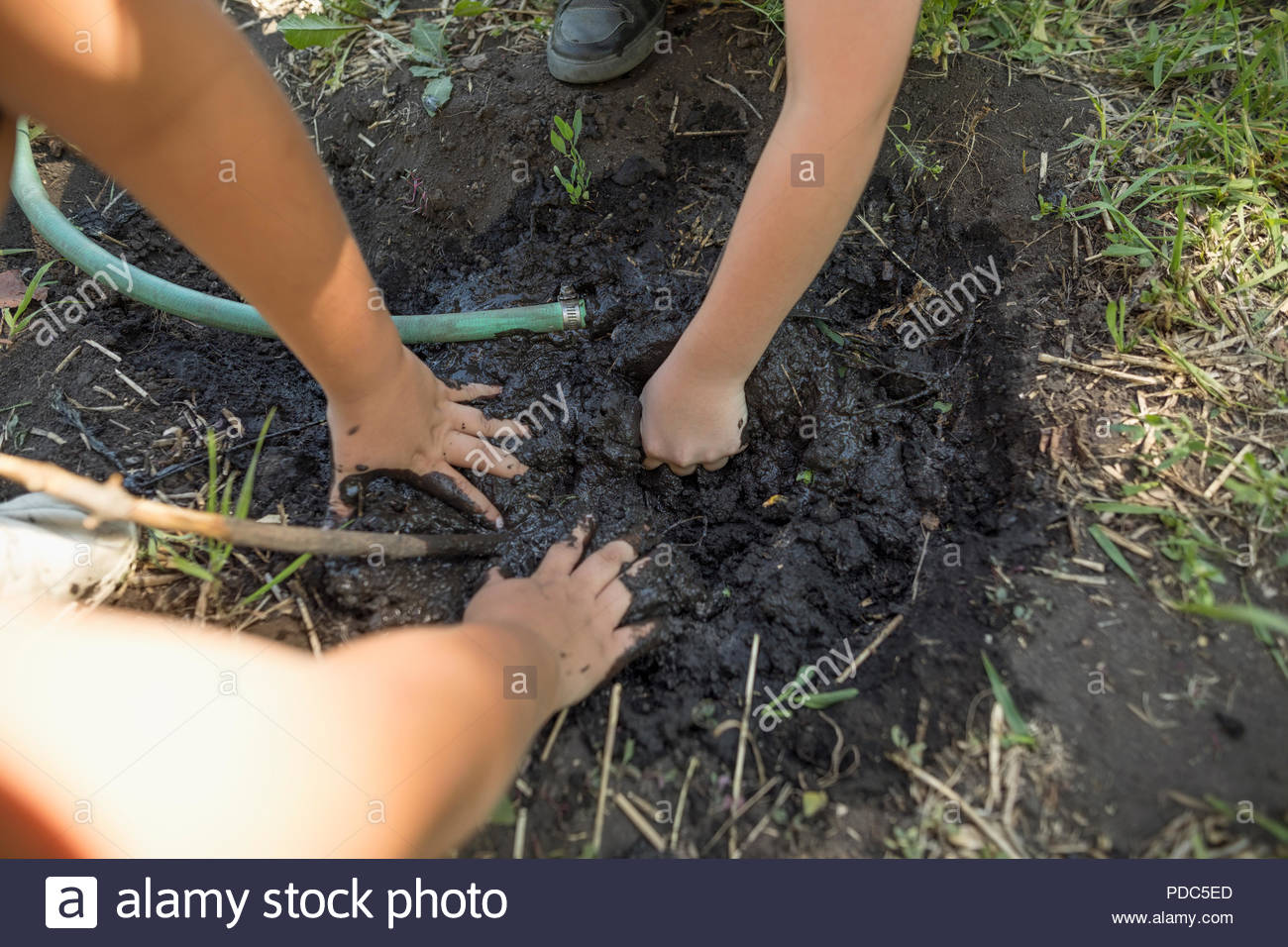 Boys in mud hi-res stock photography and images - Alamy
