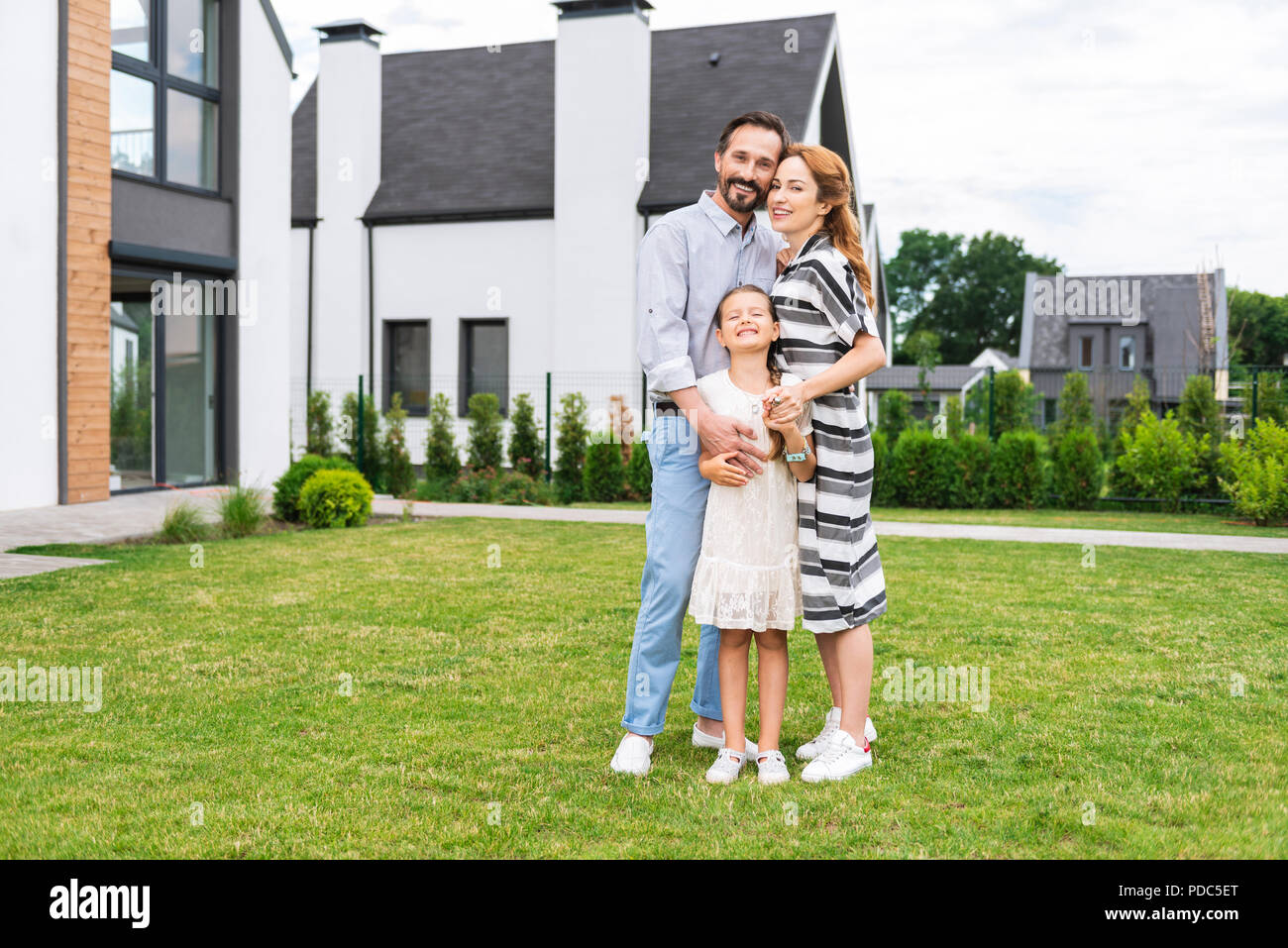 Nice positive girl standing hi-res stock photography and images - Alamy