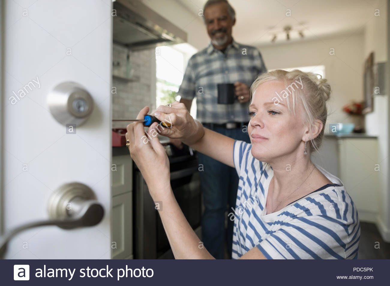Fixing a door hi-res stock photography and images - Alamy
