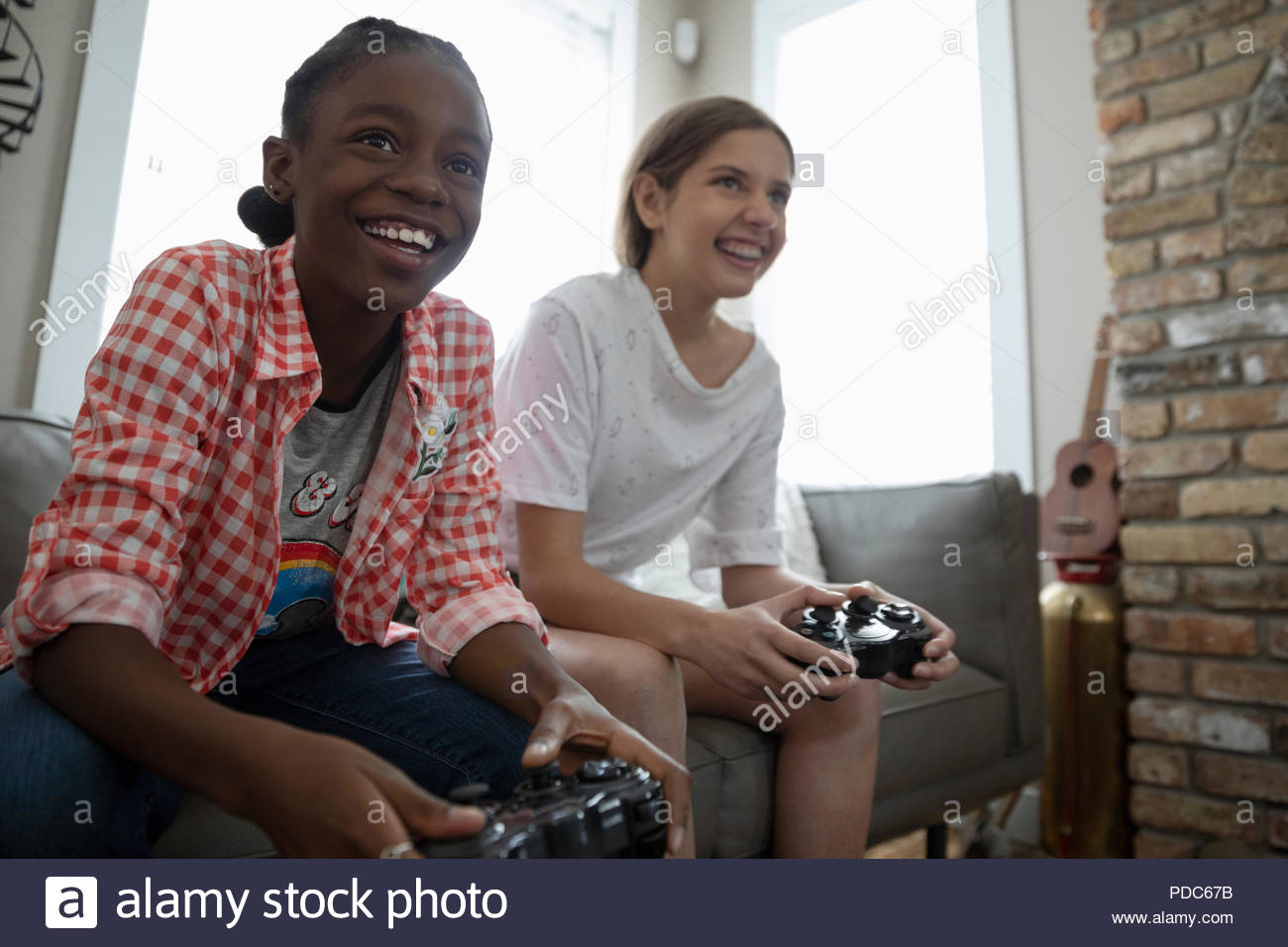 Group girls playing living room hi-res stock photography and images - Alamy