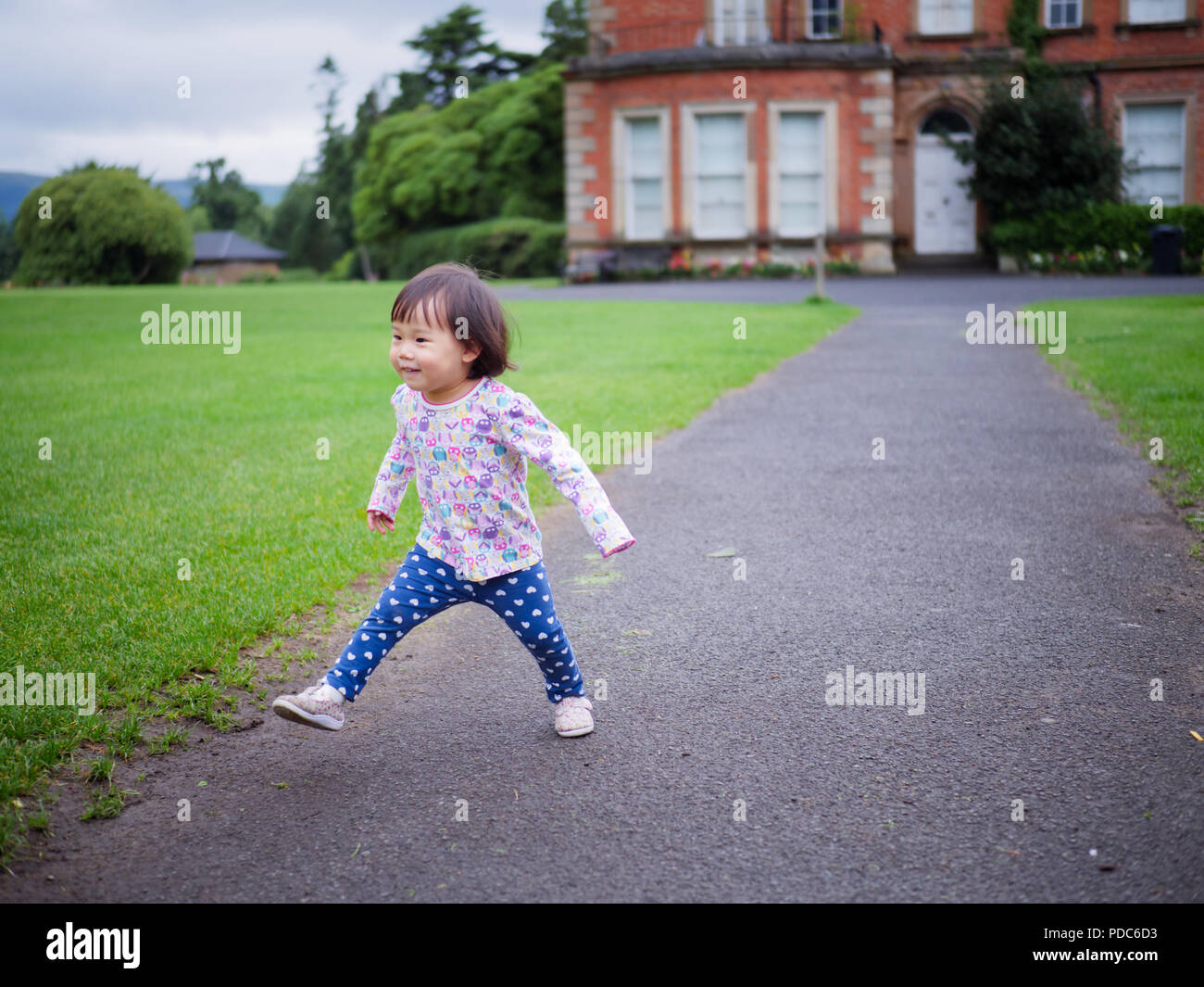 Little chinese girl running hi-res stock photography and images - Alamy