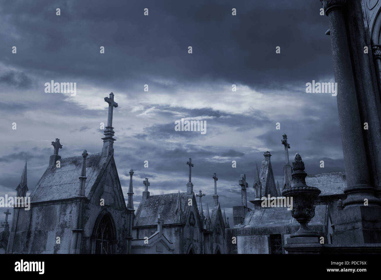 Mysterious old european cemetery. Toned blue Stock Photo - Alamy