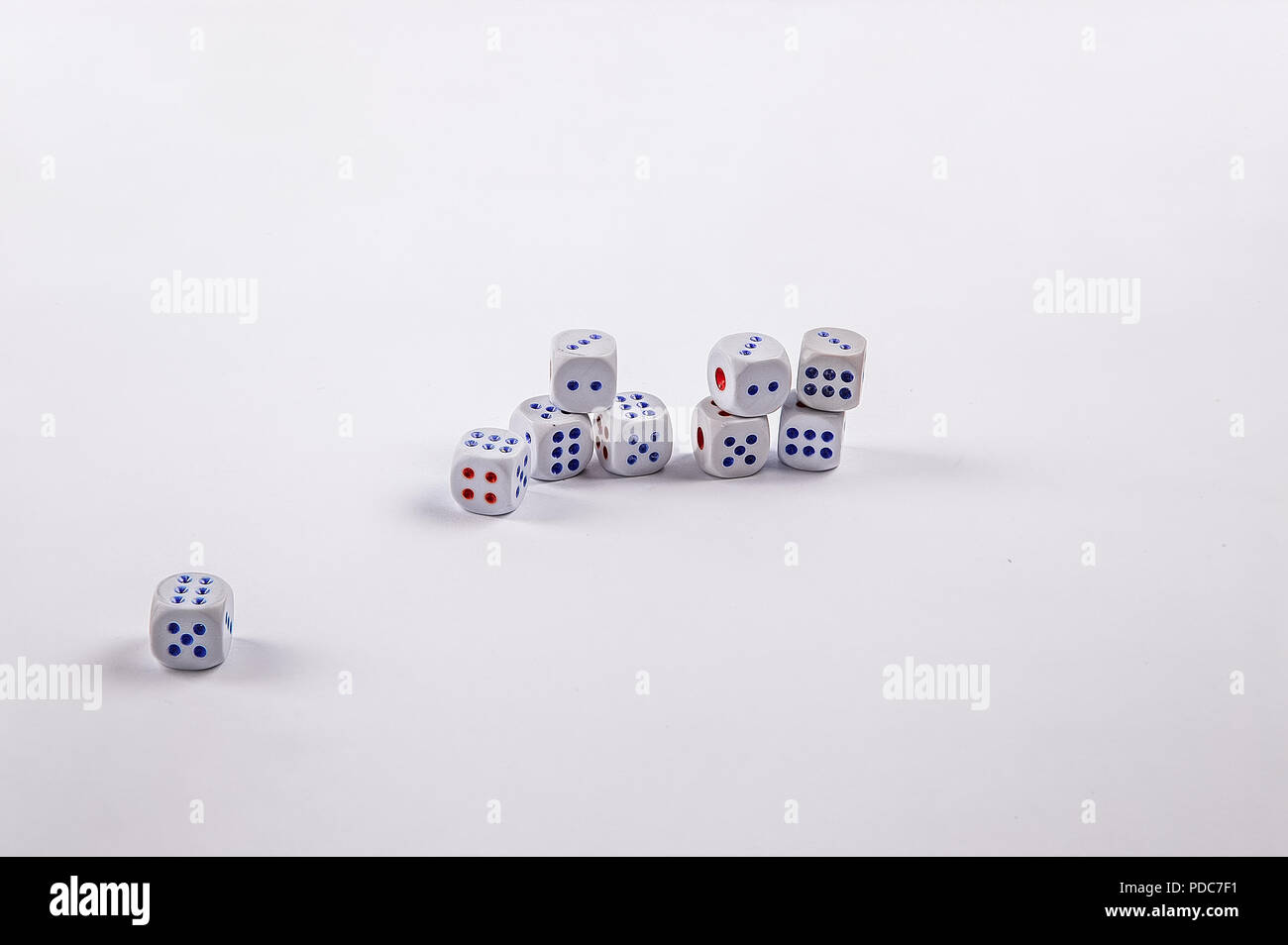 Stacks of game dice isolated on white background Stock Photo - Alamy