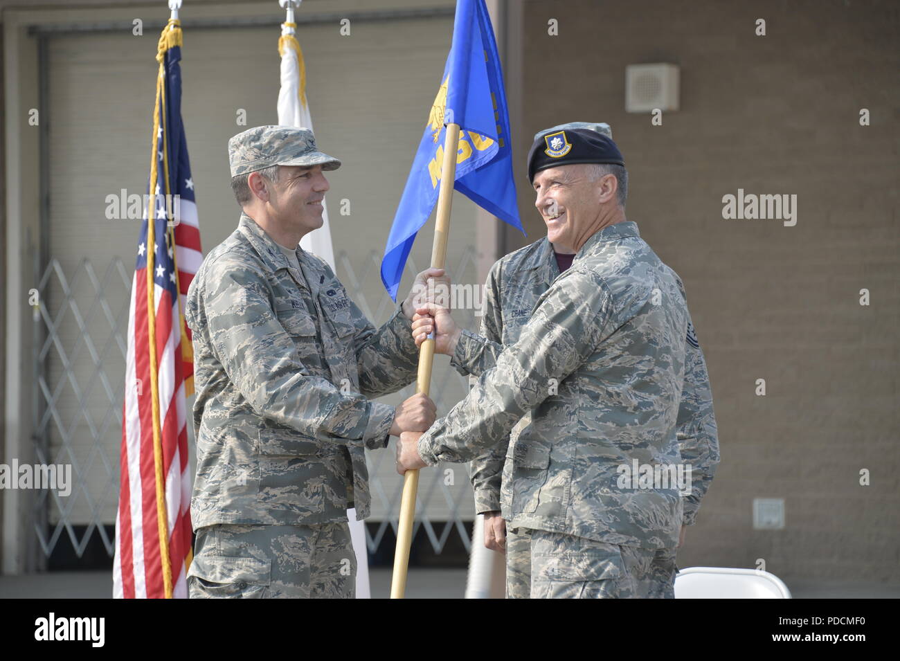 Col. Daniel Kelly, 144th Fighter Wing commander, gives the guidon to ...
