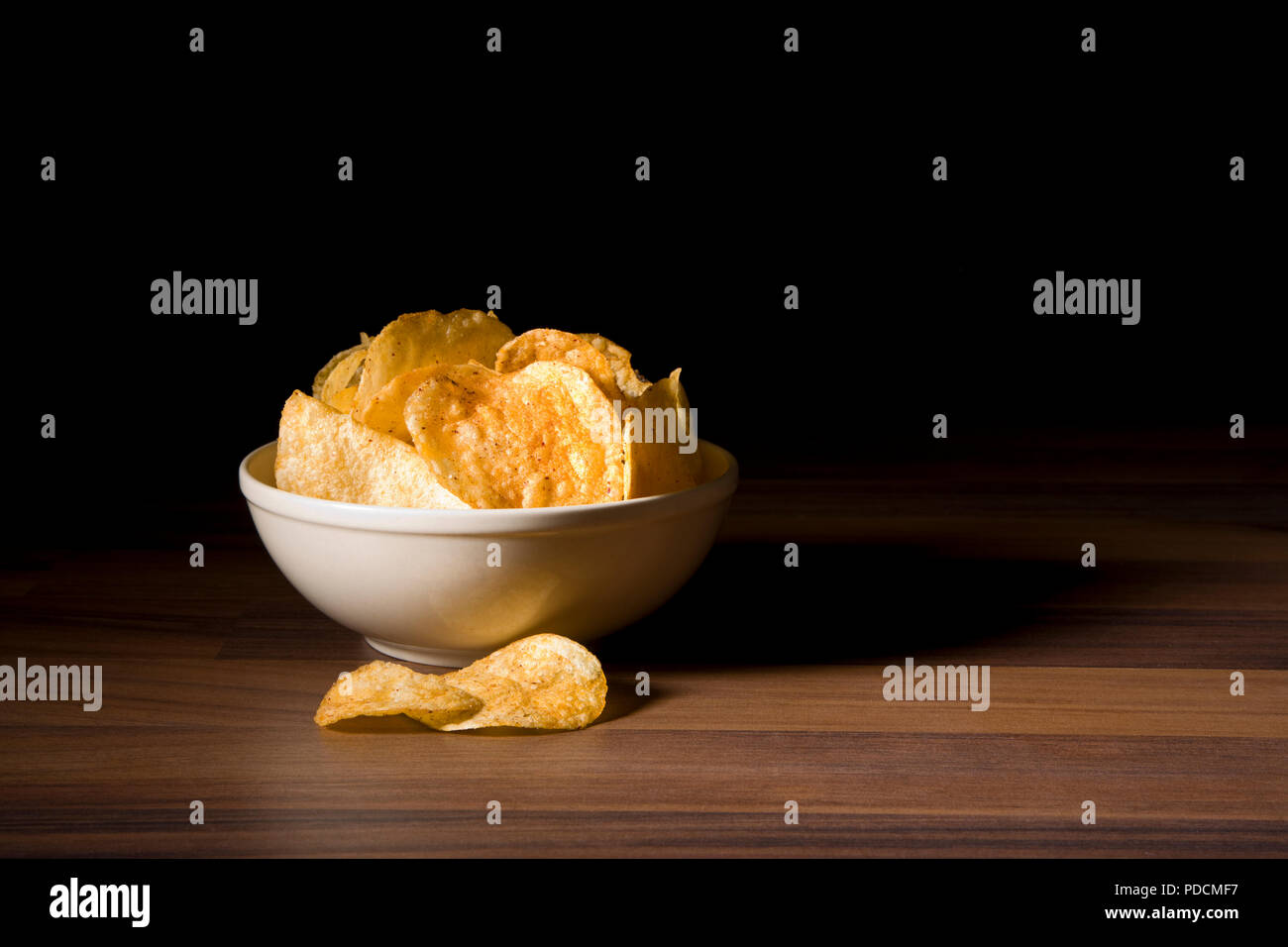 potato chips in bowl on table with copy space Stock Photo - Alamy