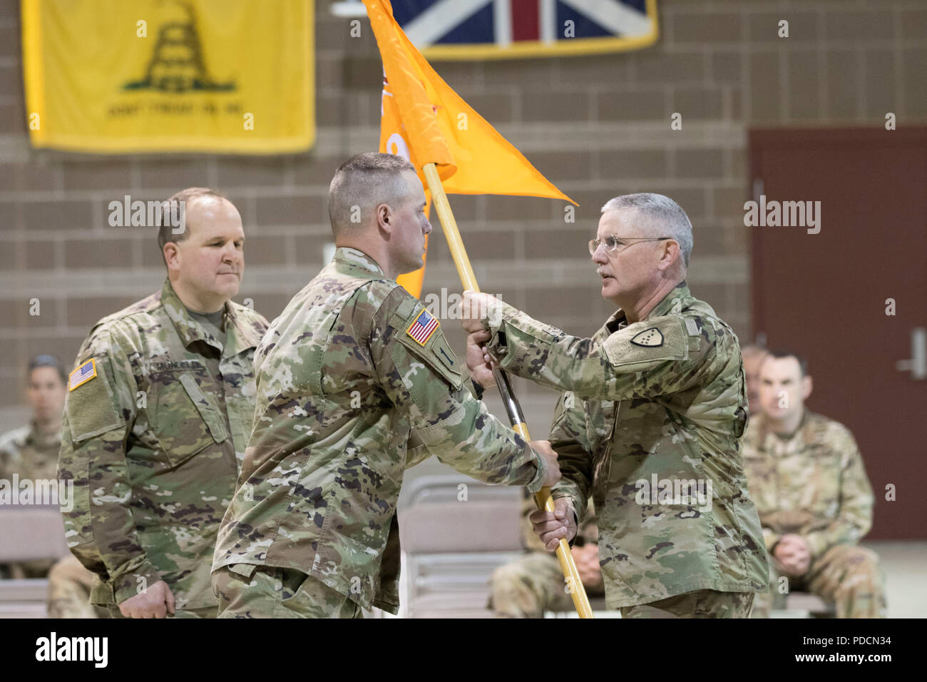 Capt. Timothy Cooper, 297th Signal Company commander, receives the unit ...