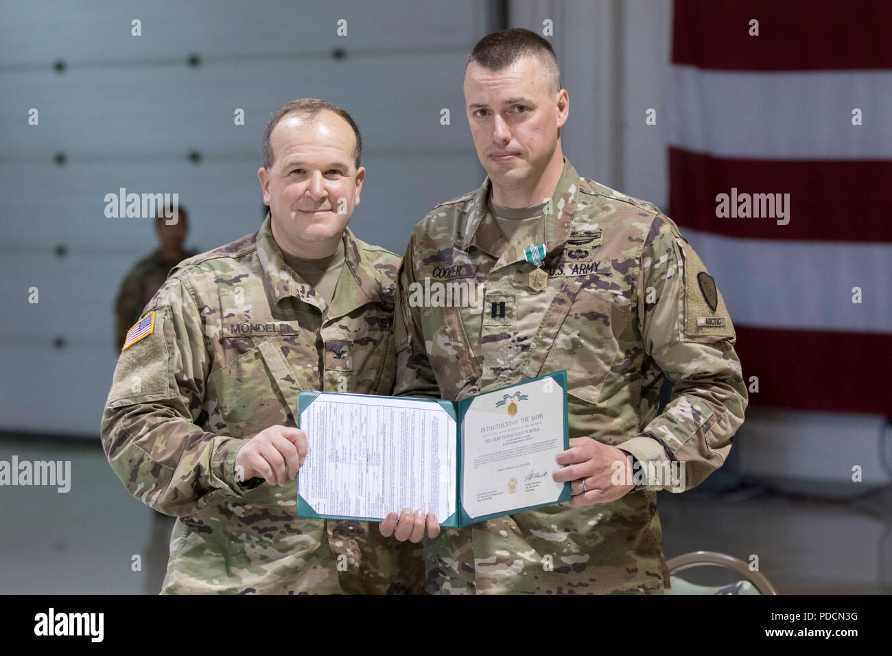 Col. Peter Mondelli, 297th Regional Support Group commander, presents ...