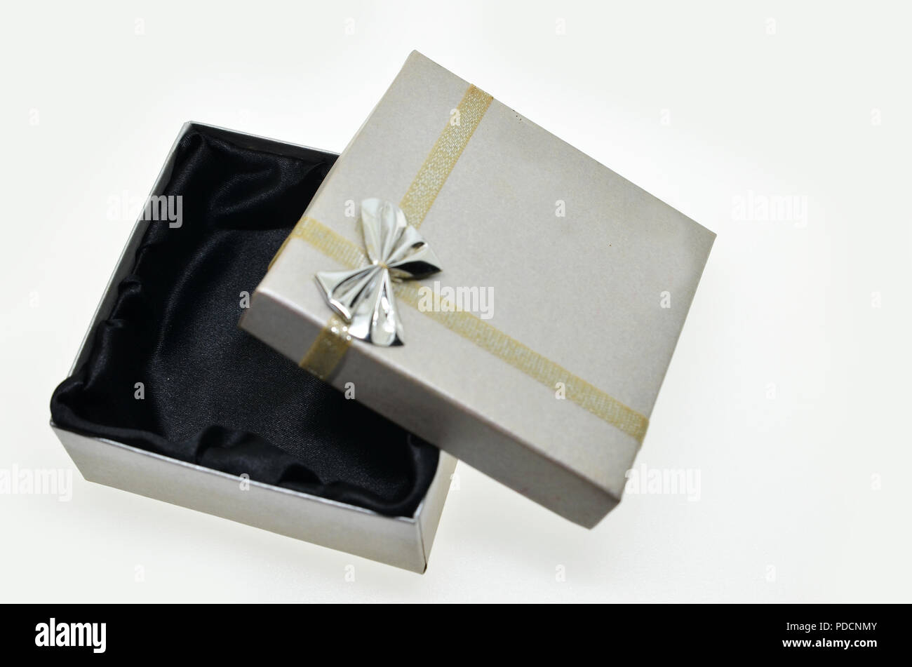 Empty gift box with small gray fabric tape with gray tie Stock Photo ...