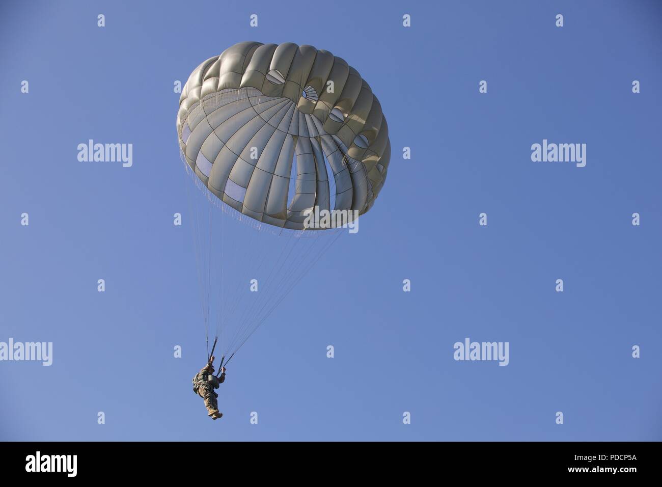 A U.S. Army Paratrooper parachute down using his MC-6 parachute onto ...