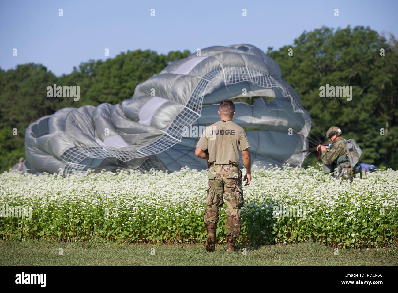 A Czech Paratrooper lands onto Castle Drop Zone with his MC-6 parachute ...