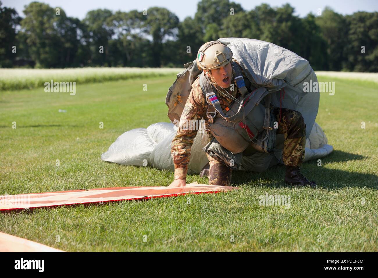 A Italian Paratrooper dives onto the X on Castle Drop Zone with his MC ...