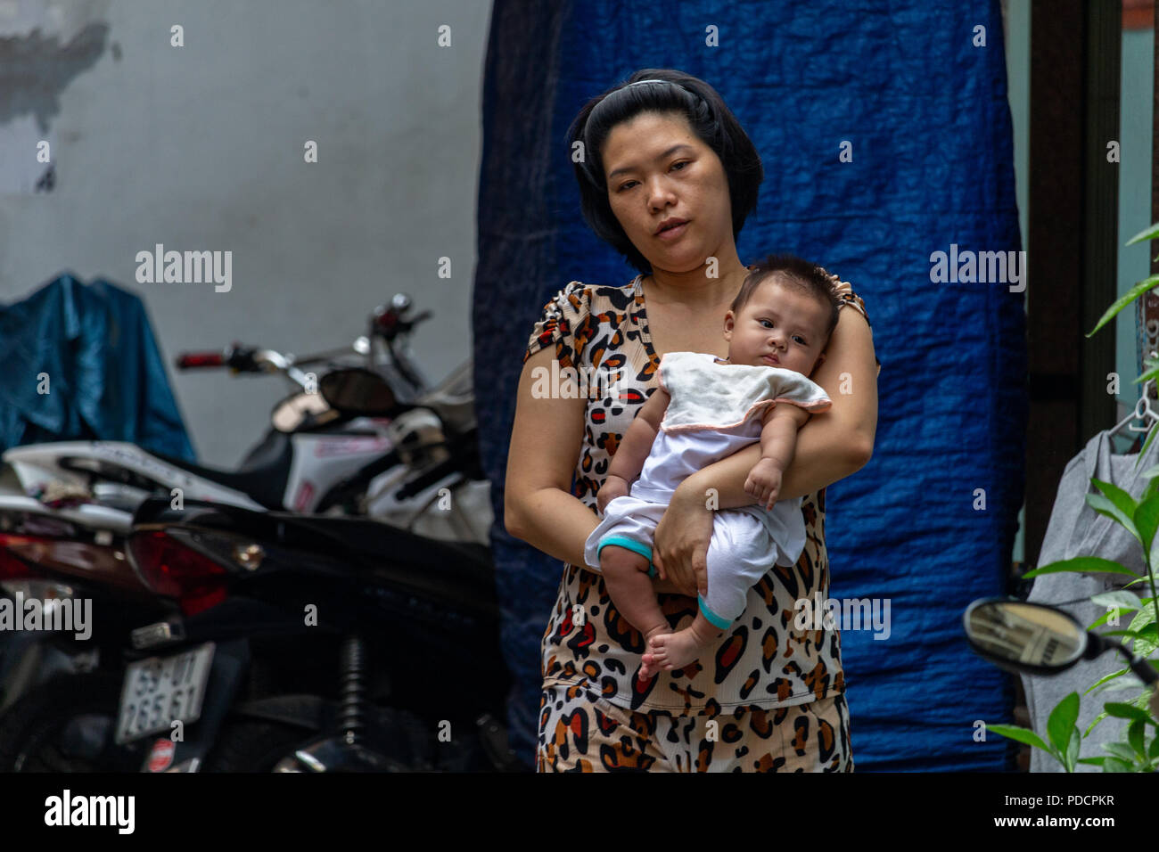 Asian parents care with their kids hi-res stock photography and images ...