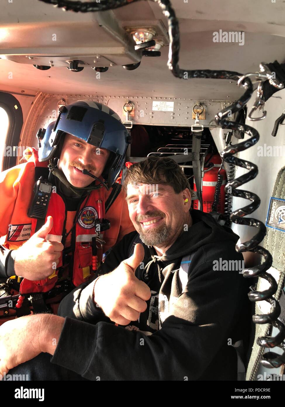 A Coast Guard Petty Officer 3rd Class Chad Morris, an aviation survival ...