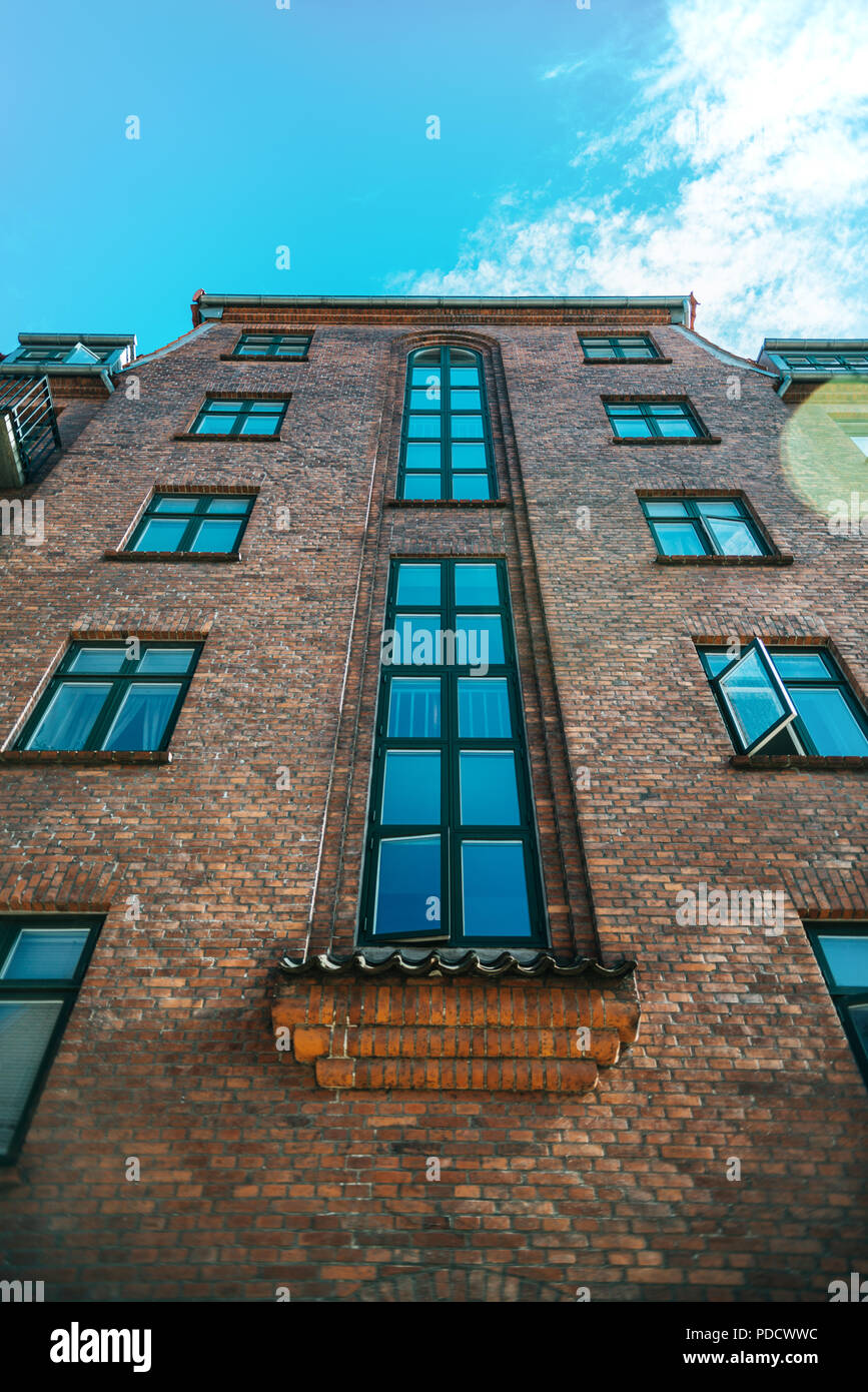 low angle view of high building and cloudy blue sky, copenhagen ...