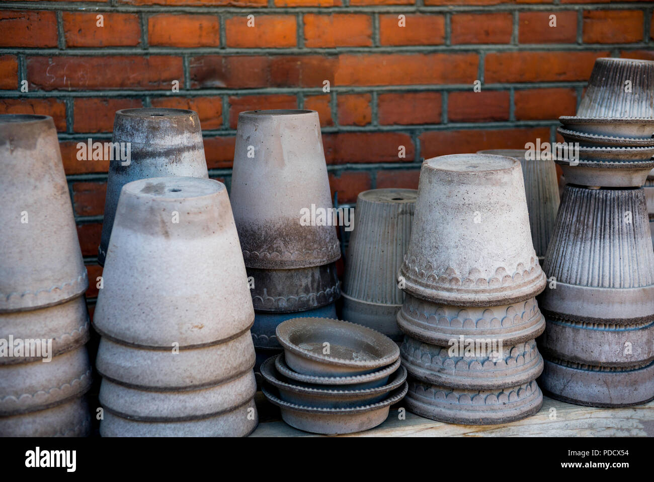 stacks of various handmade ceramic pots on shelf Stock Photo - Alamy