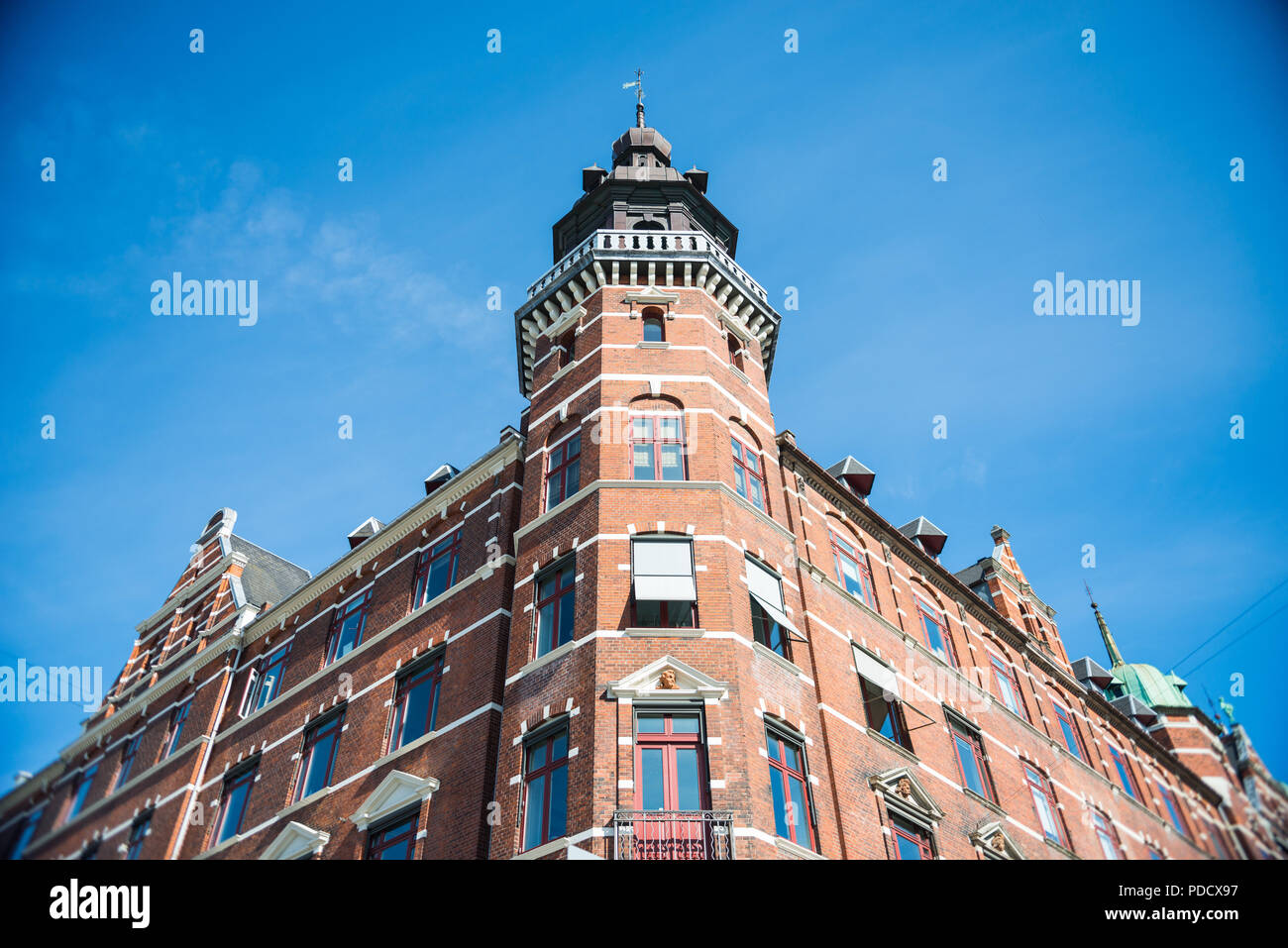 low angle view of building against bright blue sky in Copenhagen ...