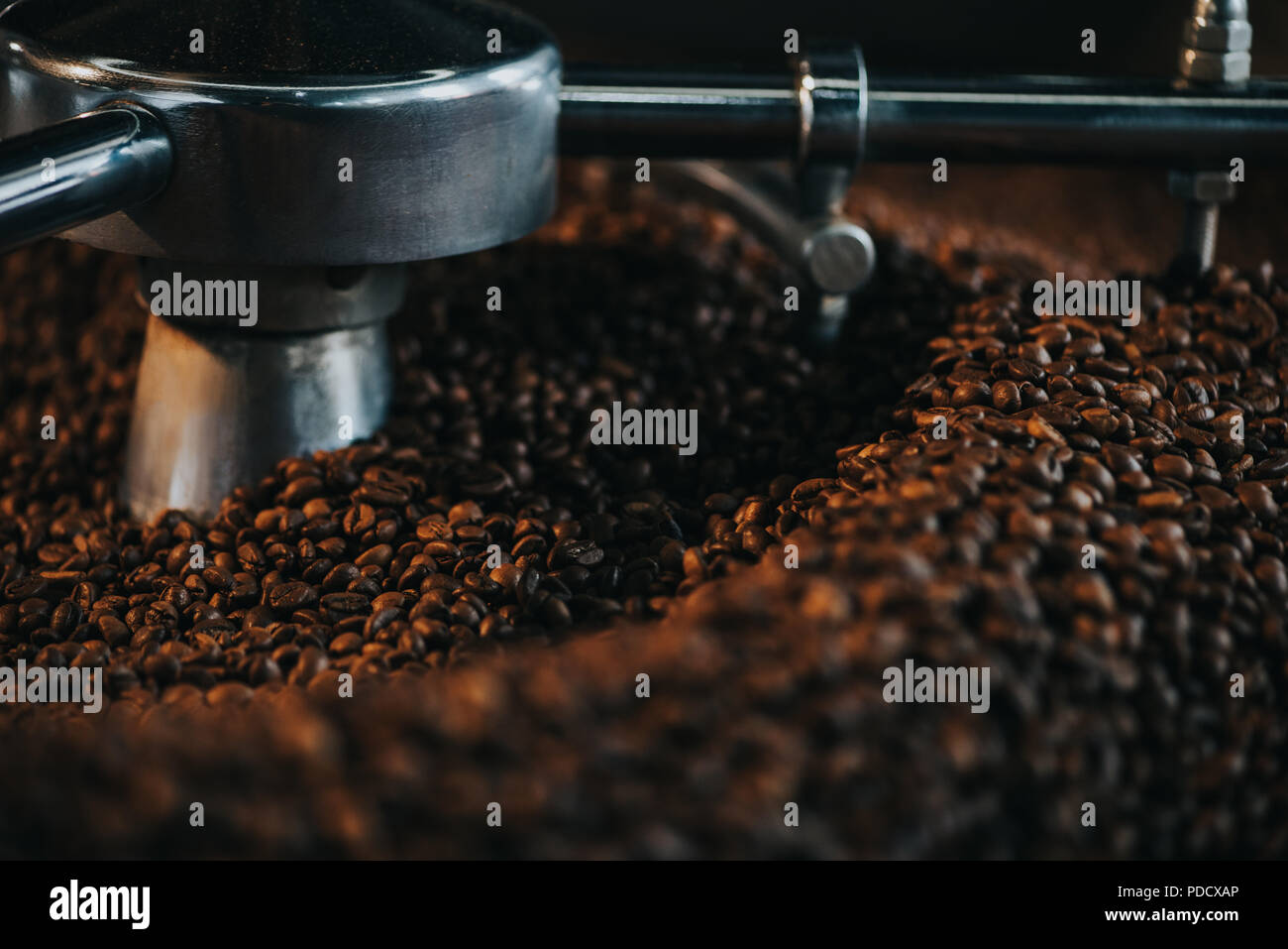 Roasting and mixing process in traditional coffee roaster cylinder ...