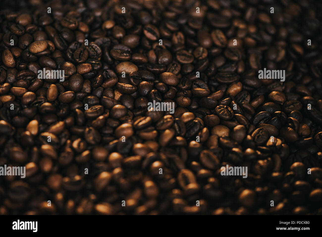 Texture of coffee beans in process of roasting Stock Photo - Alamy
