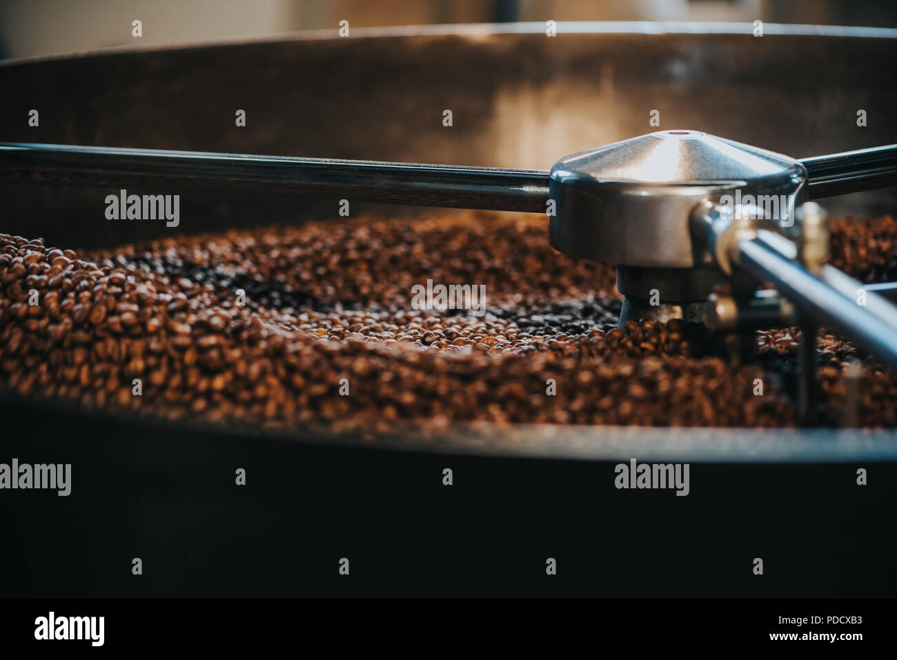 Coffee roaster cylinder roasting and mixing coffee beans Stock Photo ...