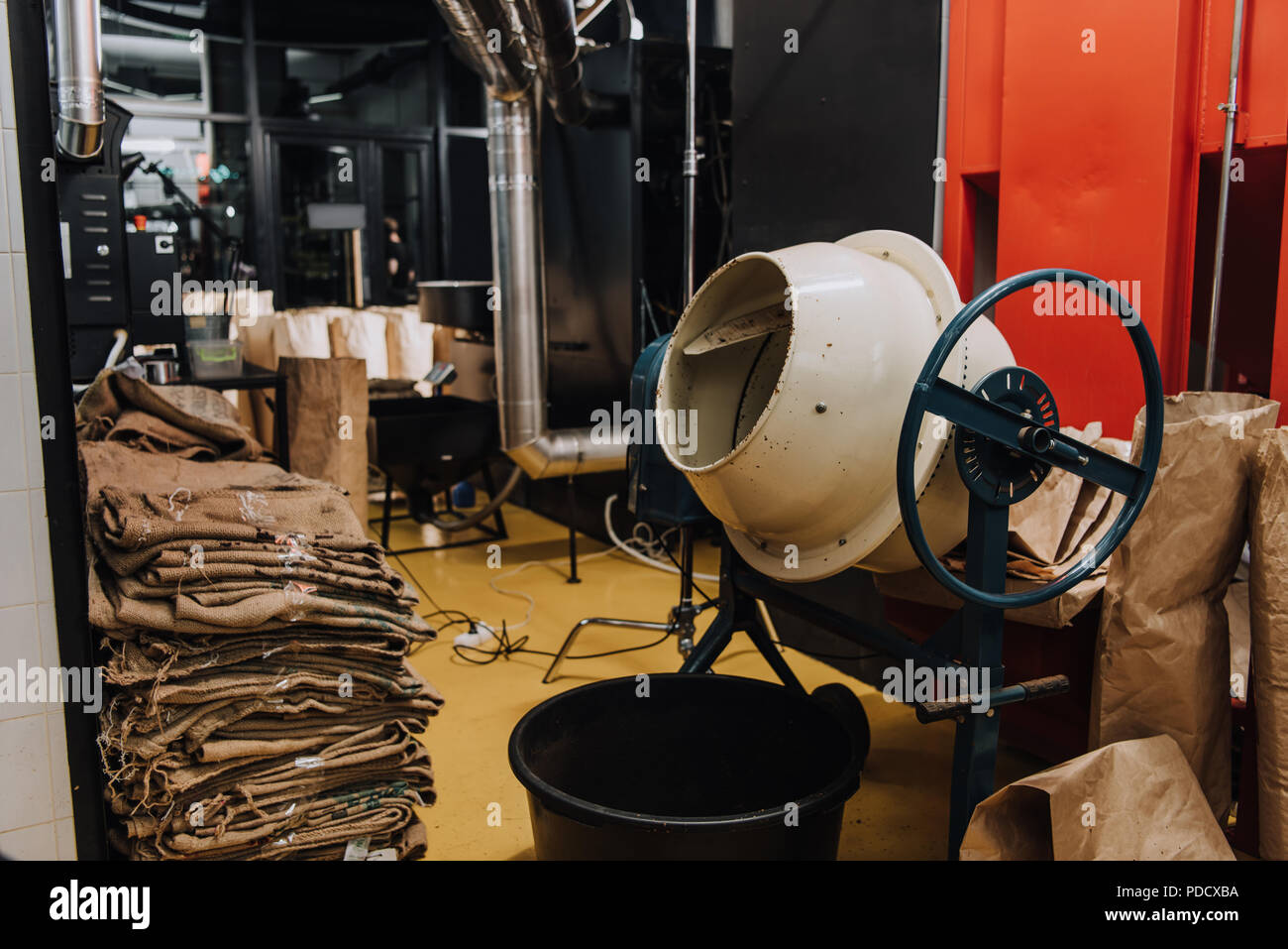 Interior of coffee production workshop with industrial equipment and ...