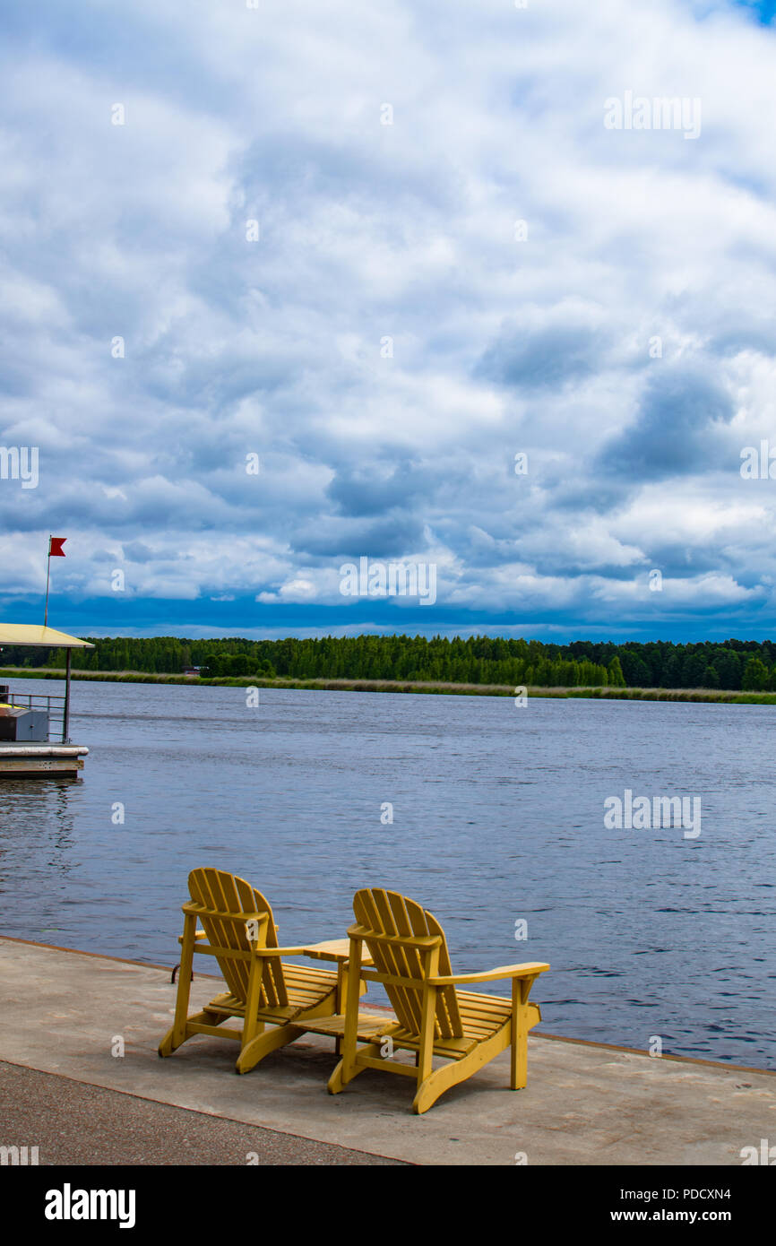 Dock and muskoka chairs on lake muskoka hi-res stock photography and ...